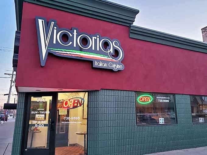 Outside View: A street-side glimpse of the red and green landmark that's been fulfilling pasta dreams for decades. Some wear capes; Victoria's wears marinara.