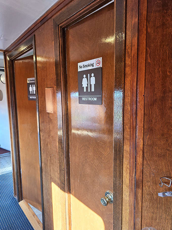 Mid-century design details extend even to the restrooms, where form and function create unexpected elegance.