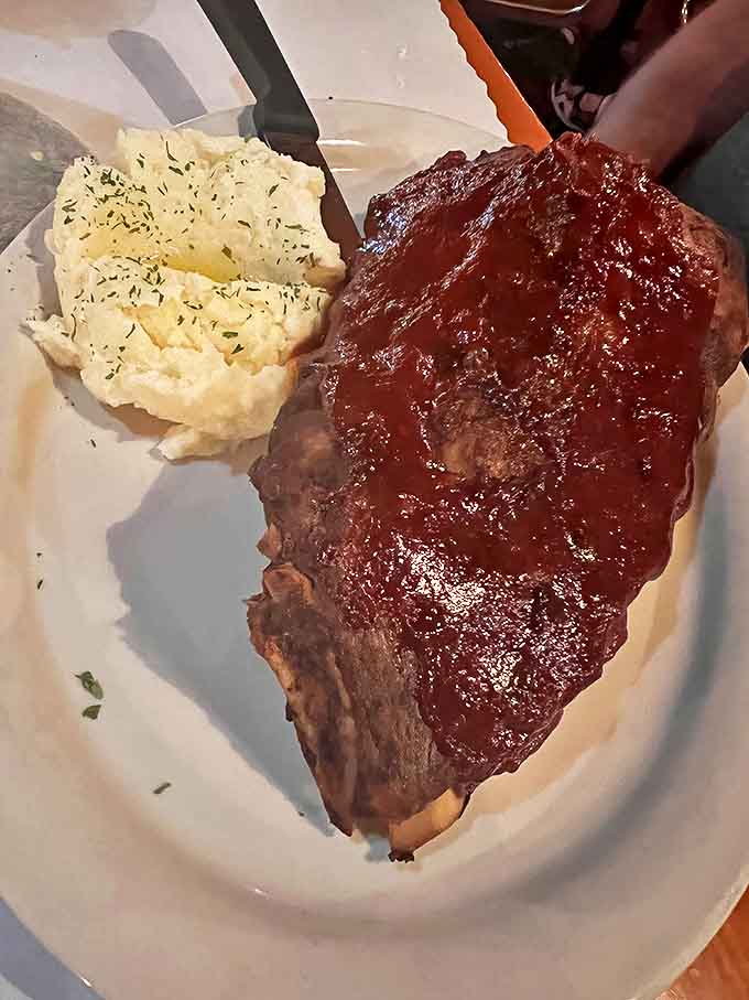 Ribs so tender they practically leap off the bone, glazed with Sweet Baby Ray's BBQ sauce and served with sides that don't dare compete for attention.