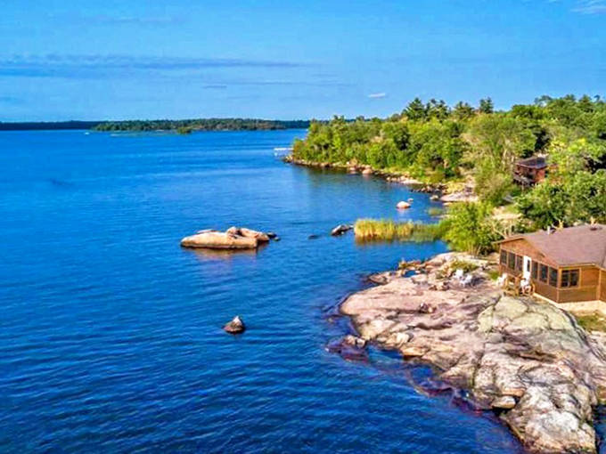 Rocky shorelines and crystal-clear waters create perfect retreats for contemplation along Lake of the Woods' edge.