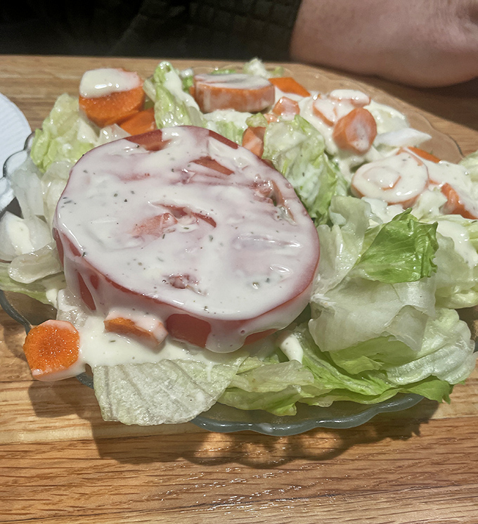 A simple house salad with creamy dressing provides the perfect fresh counterpoint to DiMaggio's hearty Italian-American classics.