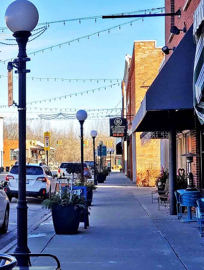 String lights crisscross above Blissfield's welcoming sidewalks, creating a magical atmosphere for evening strolls through this charming Michigan village.