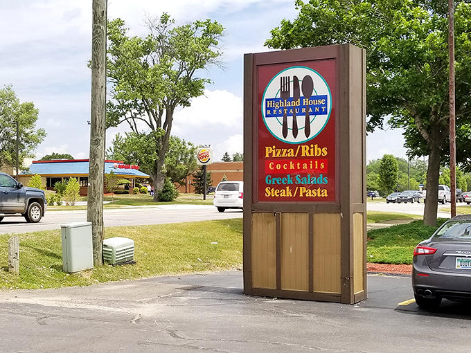 The sign stands as a beacon to hungry travelers &ndash; promising pizza, ribs, and the comfort food embrace we all crave.