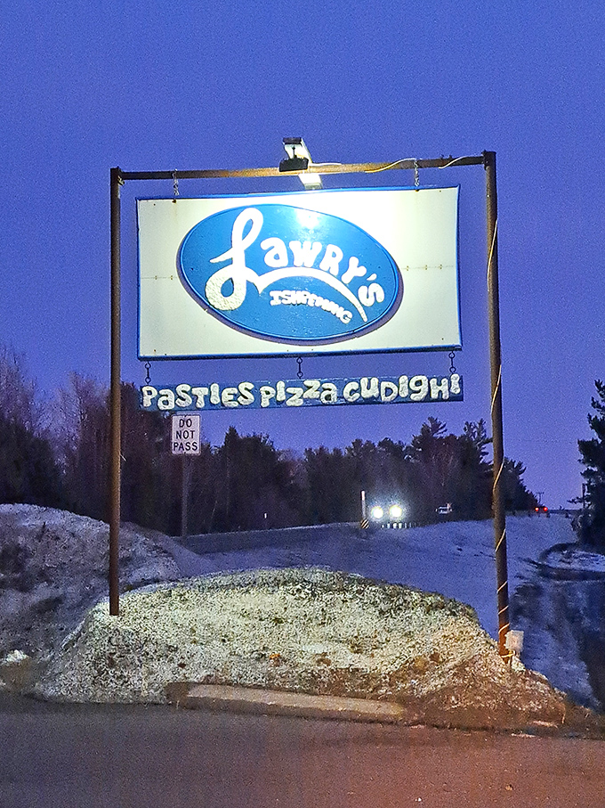 The illuminated sign guides hungry travelers like a lighthouse &ndash; "Pasties, Pizza, Cudighi" is all you need to know you've found food nirvana.