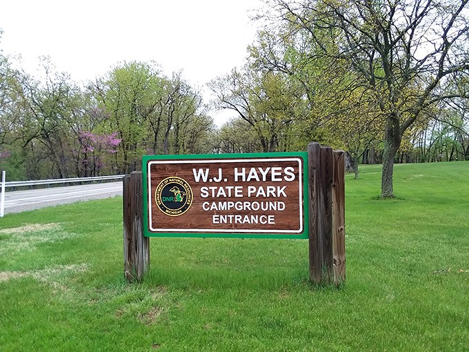 The welcoming entrance sign promises adventures ahead, standing like a portal between everyday life and natural escape.