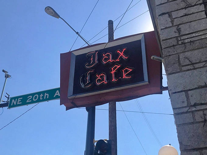 The vintage Jax Cafe sign glows against the Minneapolis sky &ndash; a beacon for those seeking exceptional dining experiences and a taste of local history.