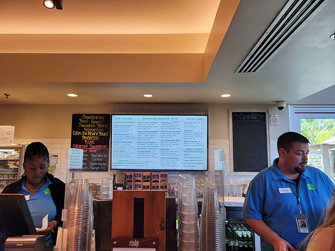 Friendly staff members stand ready to guide your culinary journey through Fogg Café's menu of garden-inspired delights.