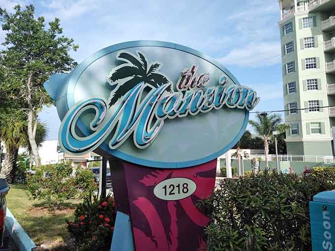 The Mansion's sign welcomes you with tropical colors and elegant script, perfectly capturing the blend of upscale dining and laid-back Florida vibes waiting inside. Photo credit: <a href="https://maps.google.com/maps/contrib/102278912396032020919" target="_blank" rel="noopener noreferrer">Jim Simons</a>	The Mansion's sign welcomes you with tropical colors and elegant script, perfectly capturing the blend of upscale dining and laid-back Florida vibes waiting inside.