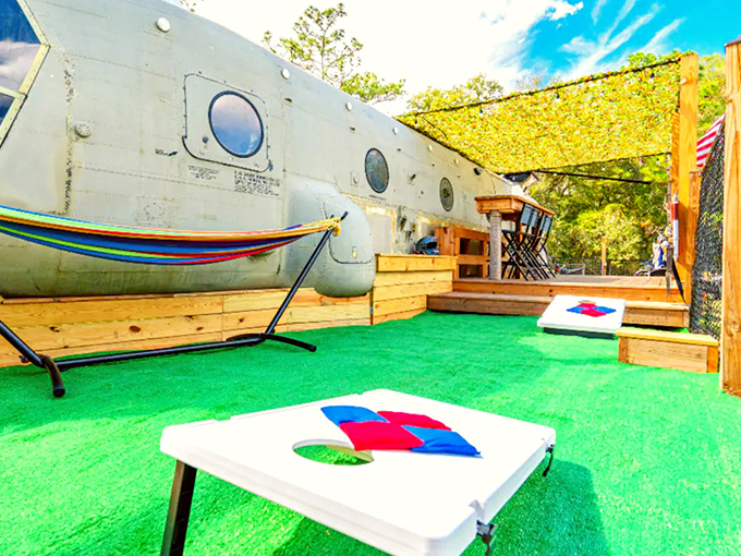 Cornhole games add a touch of backyard normalcy to your decidedly not-normal helicopter camping experience in the Florida wilderness.