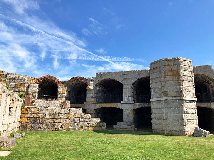 Fort Popham's weathered stone arches frame perfect views of the Kennebec River, history and natural beauty merging in granite harmony.