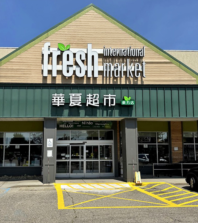 The inviting entrance welcomes shoppers with multilingual greetings, setting the stage for a shopping experience that transcends ordinary grocery runs.