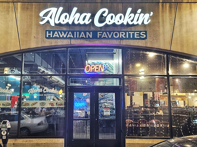 Even at night, the glowing "Aloha Cookin'" sign beckons hungry diners seeking a taste of the islands in the heart of East Lansing.