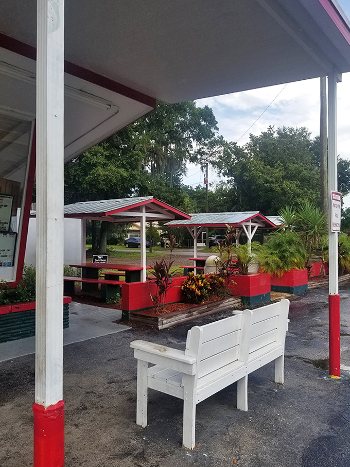 The outdoor patio with its simple red-trimmed picnic tables &ndash; where strangers become friends united by their mutual appreciation for exceptional sandwiches.
