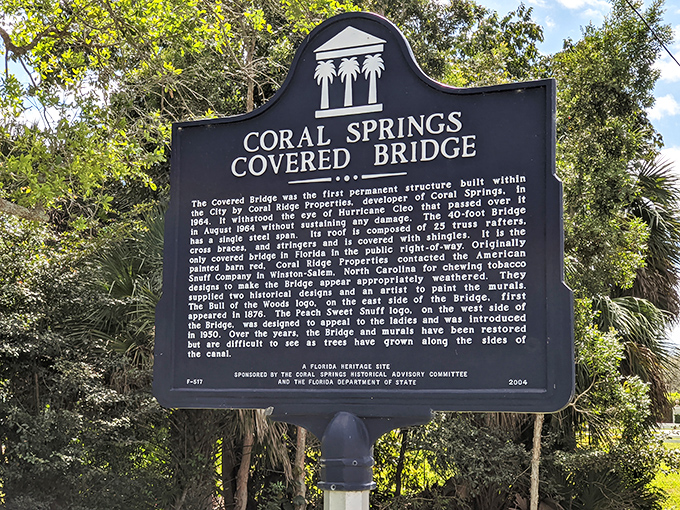 History stands tall amid Florida greenery! This elegant marker tells the bridge's remarkable story – surviving Hurricane Cleo and becoming the state's only covered bridge.