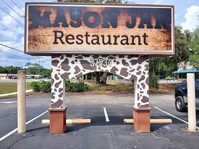 That cow-print sign frame announcing "Mason Jar Restaurant" is quirky, fun, and perfectly captures the unpretentious spirit of this beloved local spot.