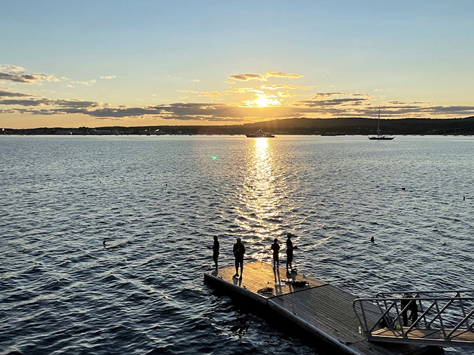 Golden hour transforms Rockland Harbor into a shimmering canvas, rewarding those who time their breakwater visit for sunset.