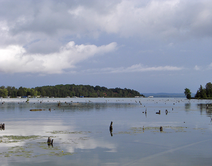 Even on cloudy days, Elk Lake's mysterious depths peek through &ndash; nature's moody masterpiece in shades of gray.