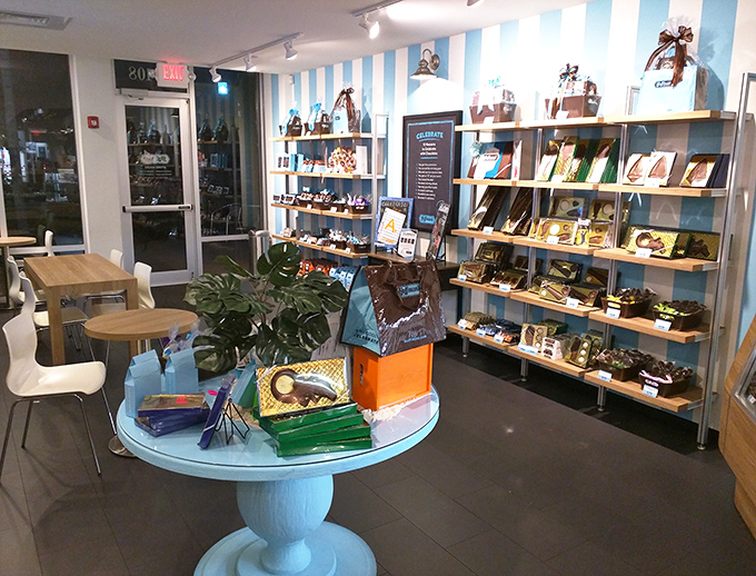 Hoffman's blue and white striped interior creates a beachy chocolate paradise, with wooden shelves displaying tempting treats for every sweet tooth.