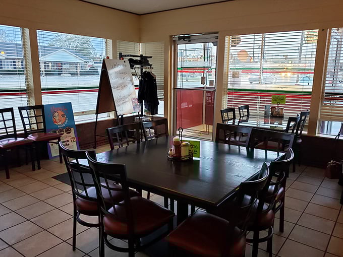 The cozy interior of Luigi's features simple, comfortable seating where countless pizza dreams have come true for locals and visitors alike.