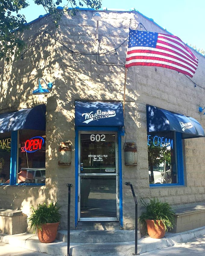 The American flag flies proudly above Washtenaw Dairy, where ice cream traditions have been scooped with love for generations of Michigan families.