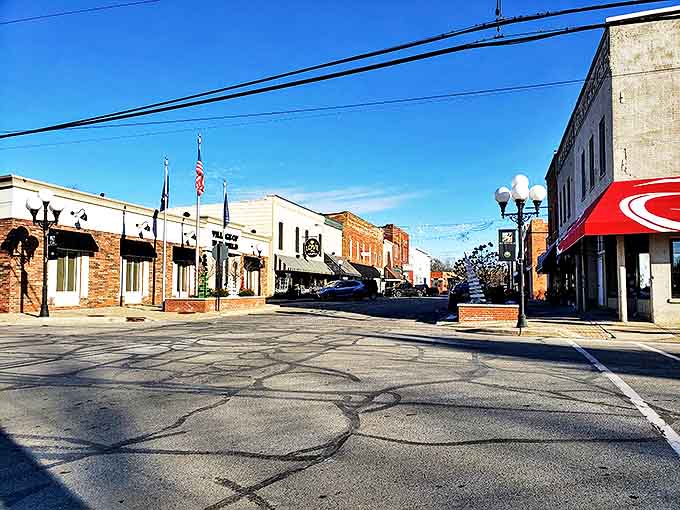 Downtown Blissfield stretches before you, where time slows down and every storefront tells a story of community pride.