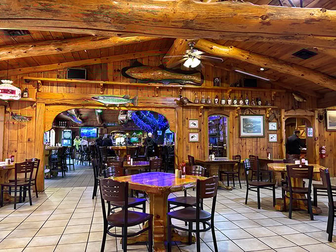 Warm wood paneling and massive log beams create a cozy atmosphere where diners can enjoy comfort food classics surrounded by Wisconsin wilderness vibes.