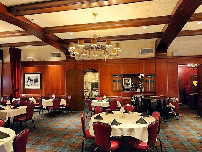 Step into a world where time slows down &ndash; rich wood paneling, plush red chairs, and white tablecloths set the stage for memorable meals and conversations.