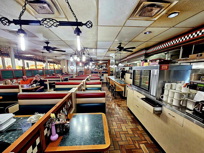 Step inside and discover a slice of Americana – herringbone wood floors, vinyl booths, and a counter where regulars swap stories over coffee.