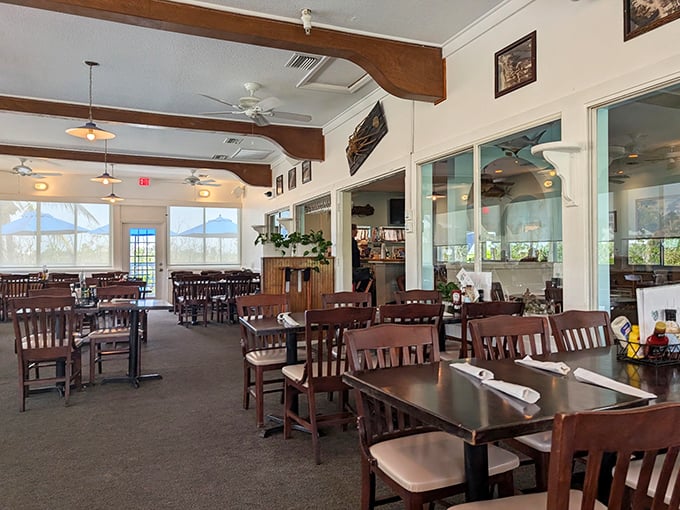 Interior: Wooden beams and natural light create the perfect backdrop for island dining&mdash;casual elegance that lets the Gulf views take center stage.