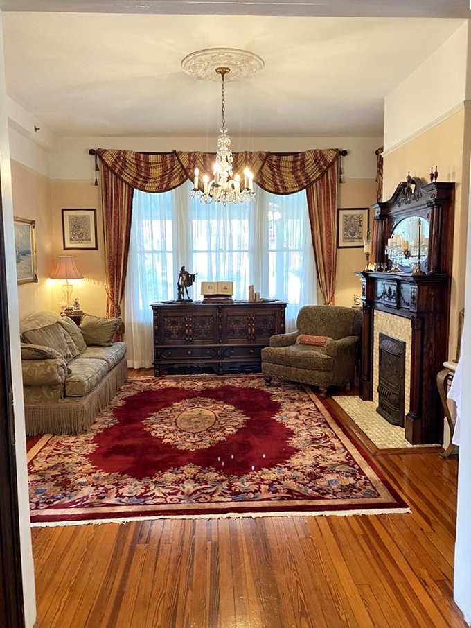 Sink into timeless comfort where antique furnishings and rich textiles create a living room that whispers stories of bygone eras.