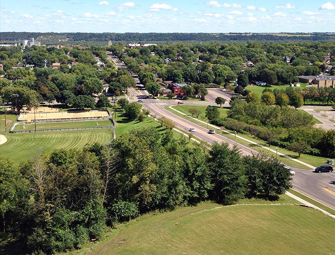 From this breathtaking overlook, New Ulm spreads below like a miniature German village transplanted into Minnesota's lush river valley.