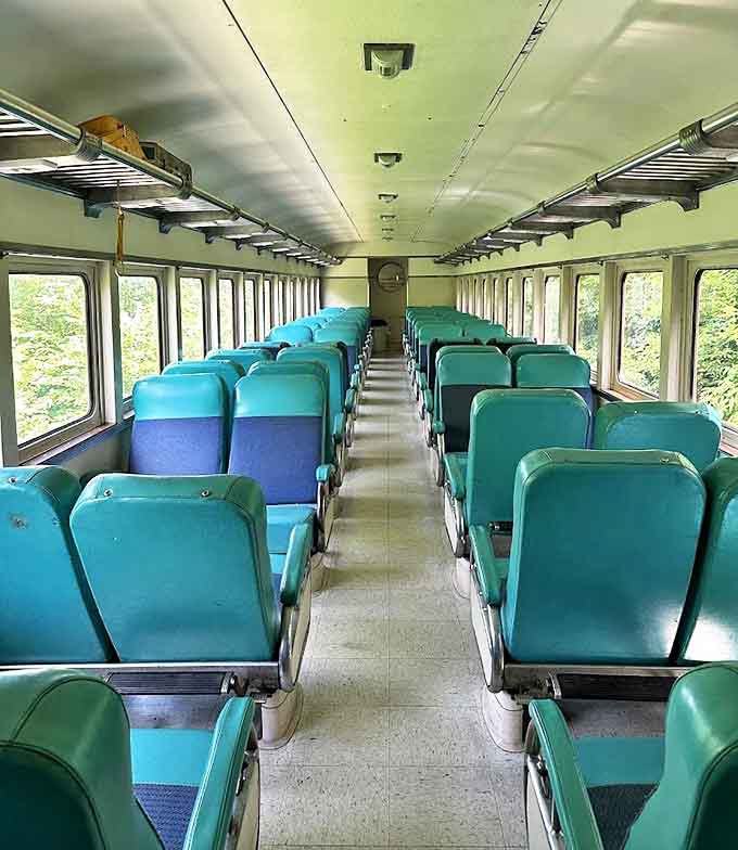 Mint-green seats line the restored passenger coach, offering comfortable viewing perches for the natural splendor that will soon unfold outside those generous windows.