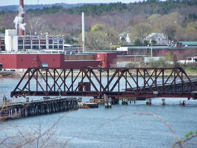 Rust never sleeps, especially on this magnificent relic. The bridge's weathered metal glows copper-orange in the afternoon sun, nature's own patina.