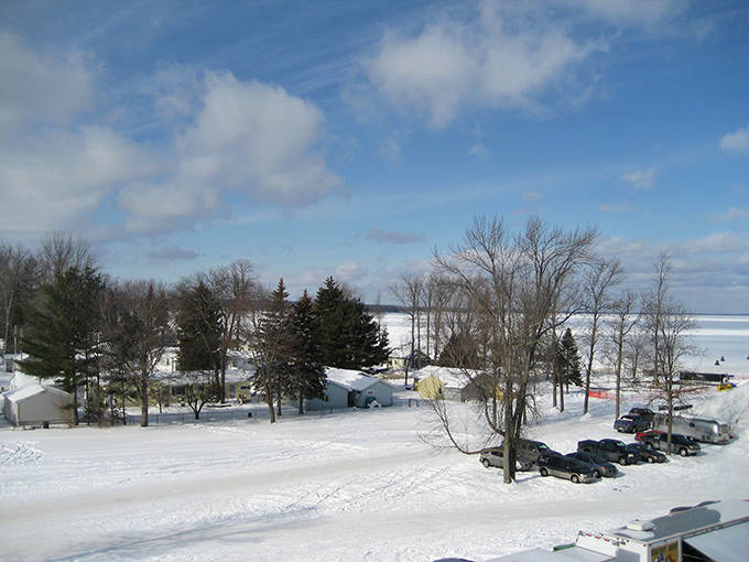 A bird's-eye view reveals the serpentine beauty of the luge track winding through snow-dusted pines like a frozen river of fun.
