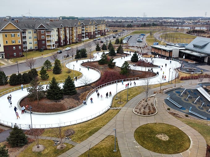 From above, the skating loop reveals its serpentine beauty, a frozen river cutting through snow-covered terrain that would make even Elsa jealous.