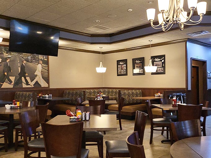 Interior: Beatles memorabilia adorns warm wood-paneled walls while Abbey Road watches over diners, creating an atmosphere that's part museum, part cozy neighborhood joint.