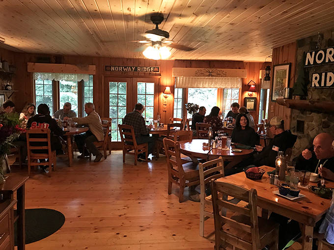 Pine-paneled walls and wooden beams create the ultimate northwoods dining atmosphere, where conversations flow as freely as the drinks.