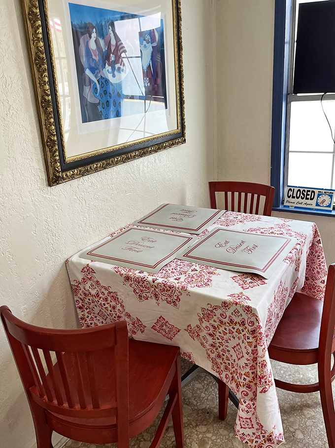 Inside, checkered tablecloths and framed art create the cozy vibe of dining in your coolest aunt's kitchen.