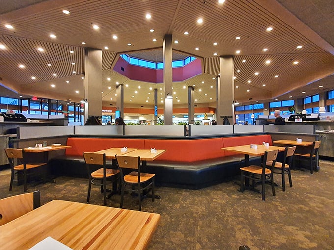 Bathed in natural light, the spacious interior with its orange accents and wooden tables invites diners to settle in for a feast of epic proportions.