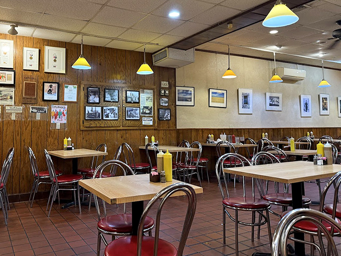 The dining room at Cecil's feels like a comfortable time capsule &ndash; wood paneling, chrome-rimmed tables, and red vinyl chairs that have witnessed countless conversations.