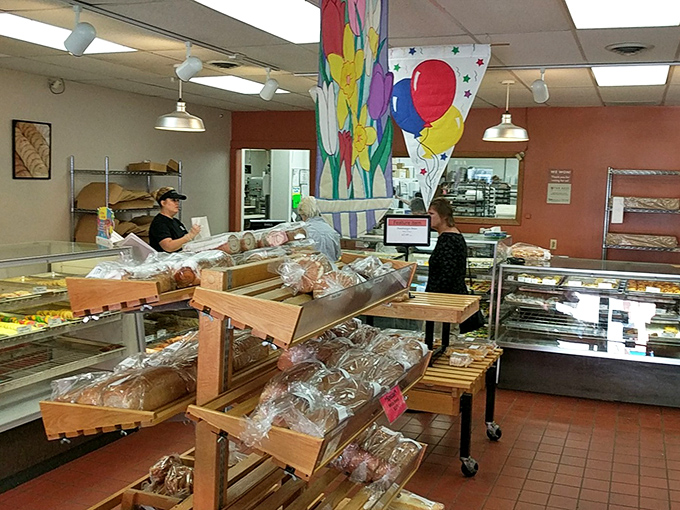 Inside the bakery, where decisions become deliciously difficult as customers contemplate the day's fresh offerings.