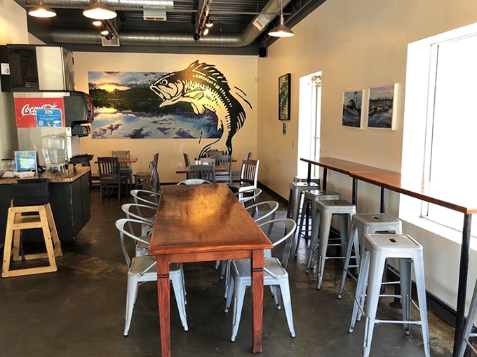 Inside Mac's, a painted bass watches over diners while wooden tables invite you to settle in for a feast of freshly fried delights.