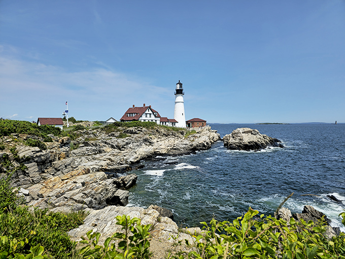 Portland Head Light stands sentinel over Casco Bay, its white tower a beacon to both ships and camera-wielding visitors alike.