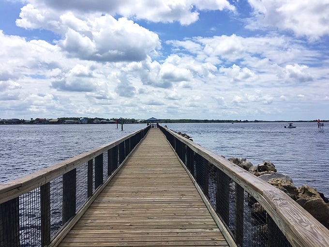 Morning light dances across the weathered wooden planks, inviting early risers for contemplative strolls above gentle Gulf waters.