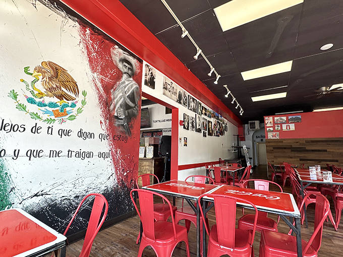 Interior: Vibrant red chairs and Mexican murals create an atmosphere where revolutionary spirit meets comfort food coziness.