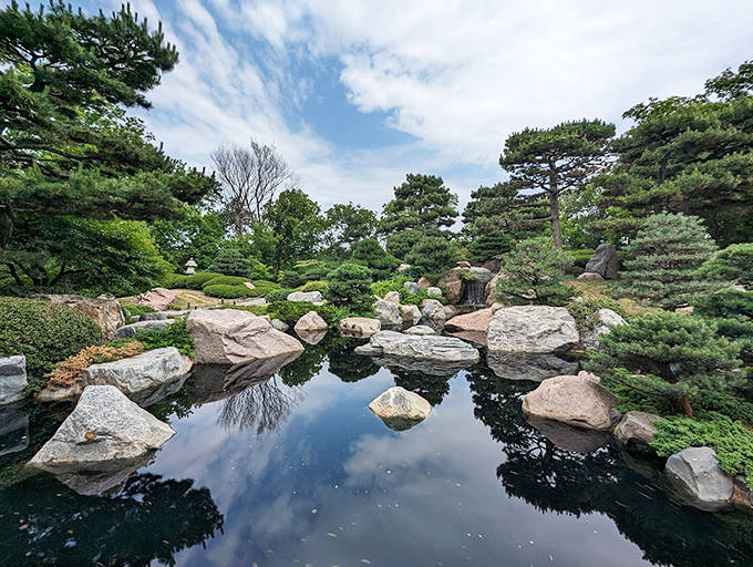 Tranquility flows through every carefully placed stone in the Japanese Garden, where koi fish create living art beneath the reflective surface.