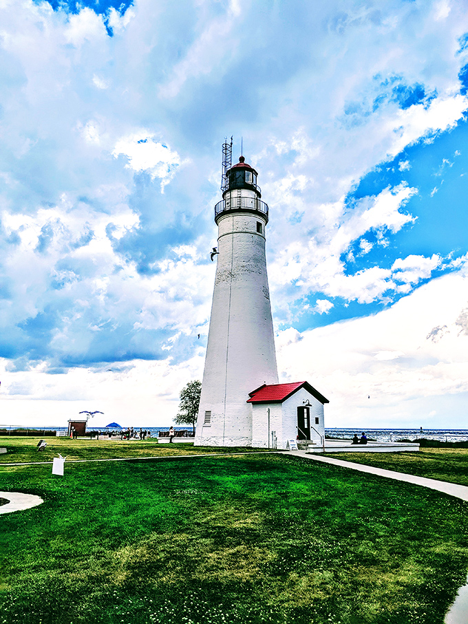 Standing sentinel against dramatic skies, Fort Gratiot's pristine white tower has guided mariners safely home since the early days of Michigan statehood.