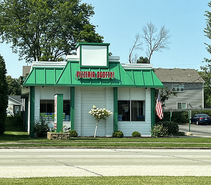 Pizzeria Scotty's distinctive green-roofed building stands out like an emerald beacon for pizza pilgrims searching for authentic Wisconsin flavor.