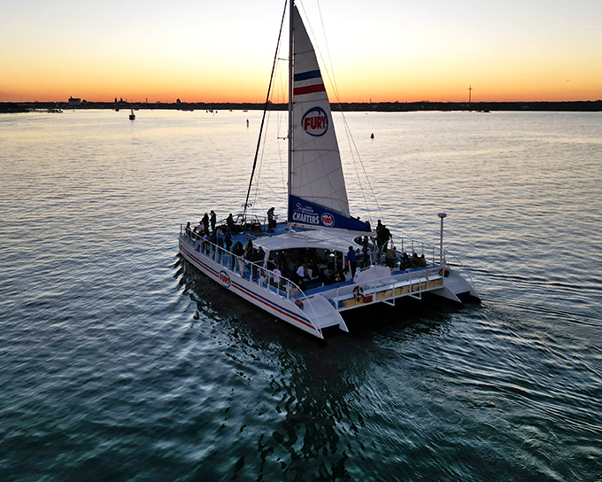 Sunset sailors catch golden hour magic on Vilano's waters, where every evening ends with nature's light show.