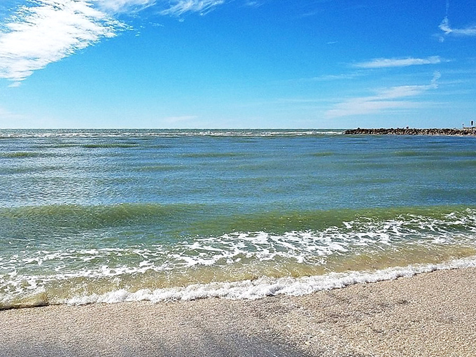The gentle slope of Blind Pass Beach creates perfect wading conditions for shell hunters of all ages.